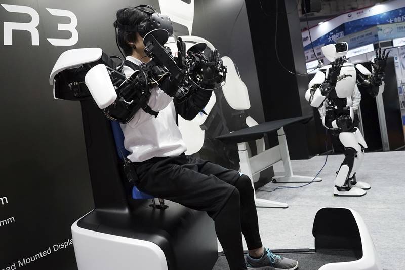 Toyota showcases third generation humanoid robot T-HR3 that mirrors ...