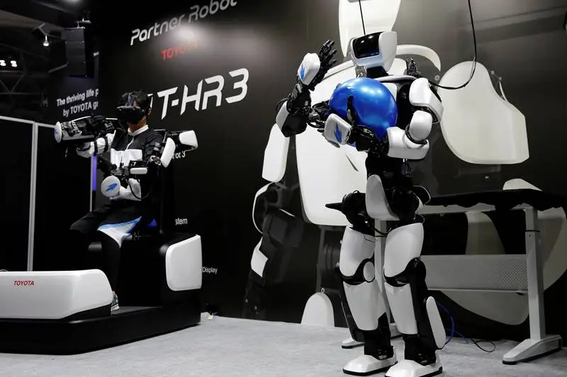 Toyota showcases third generation humanoid robot T-HR3 that mirrors ...
