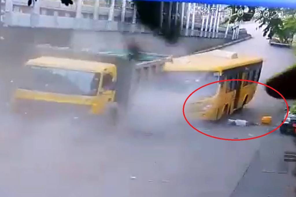 Watch: Man falls off speeding bus as it rams into dumper truck in ...